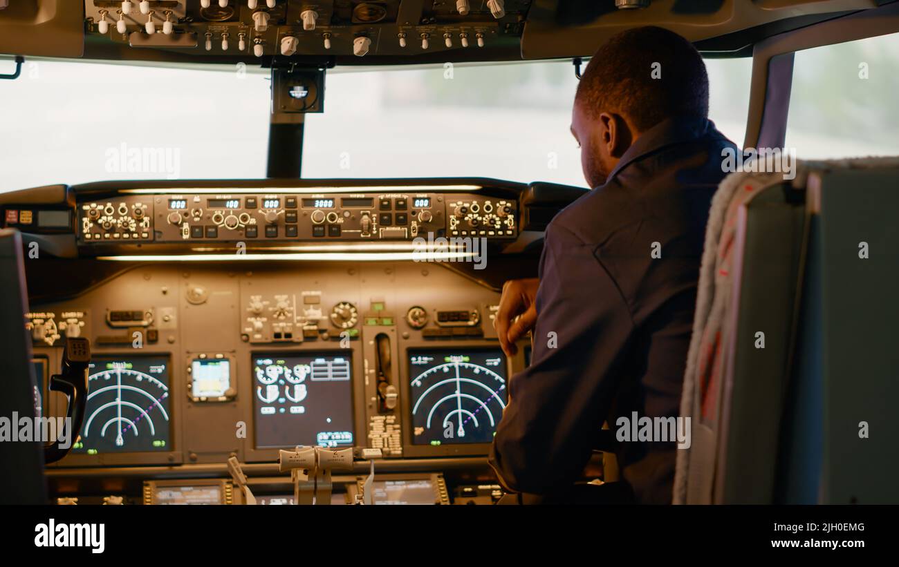 African american captain inserting destination coordinates to help ...