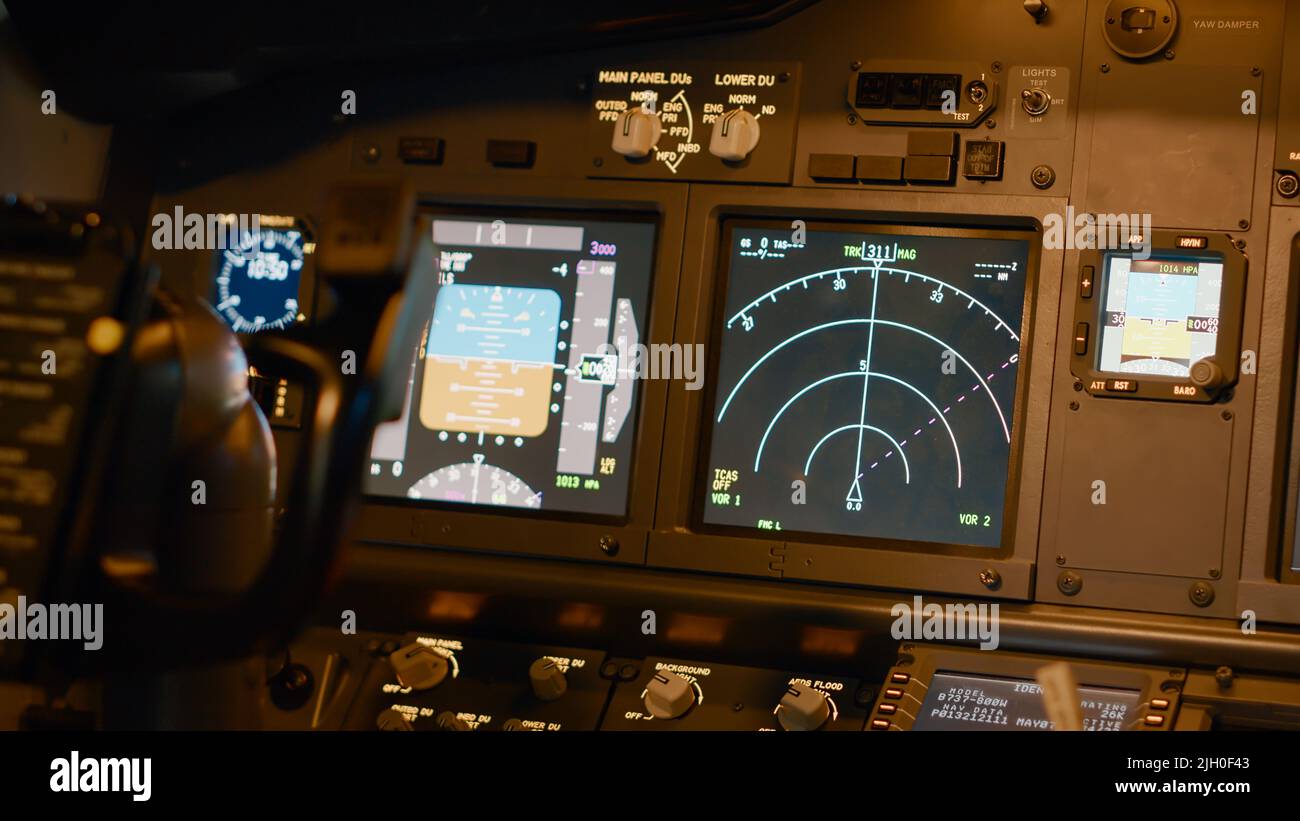 Radar compass and windscreen on dashboard in cockpit used by captain to ...