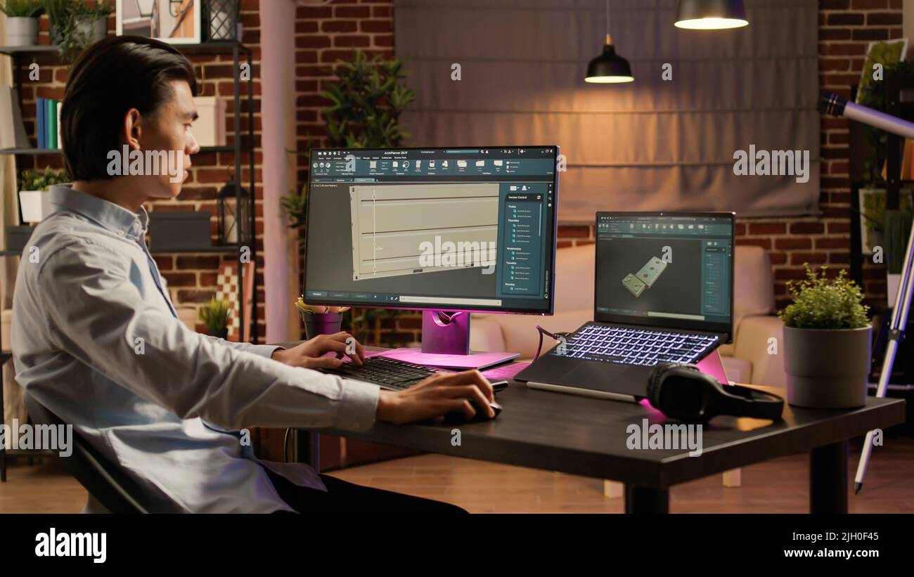 Digital technician designing industrial container and engine component ...