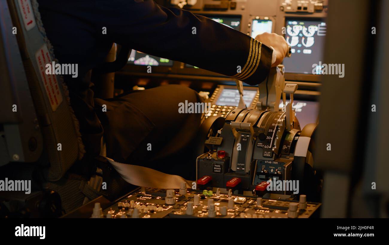 Aviation crew flying airplane with engine lever to throttle, using ...