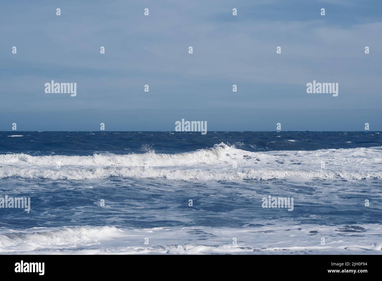 Ocean storm waves dramatically crashing splashing. Sky horizon line ...