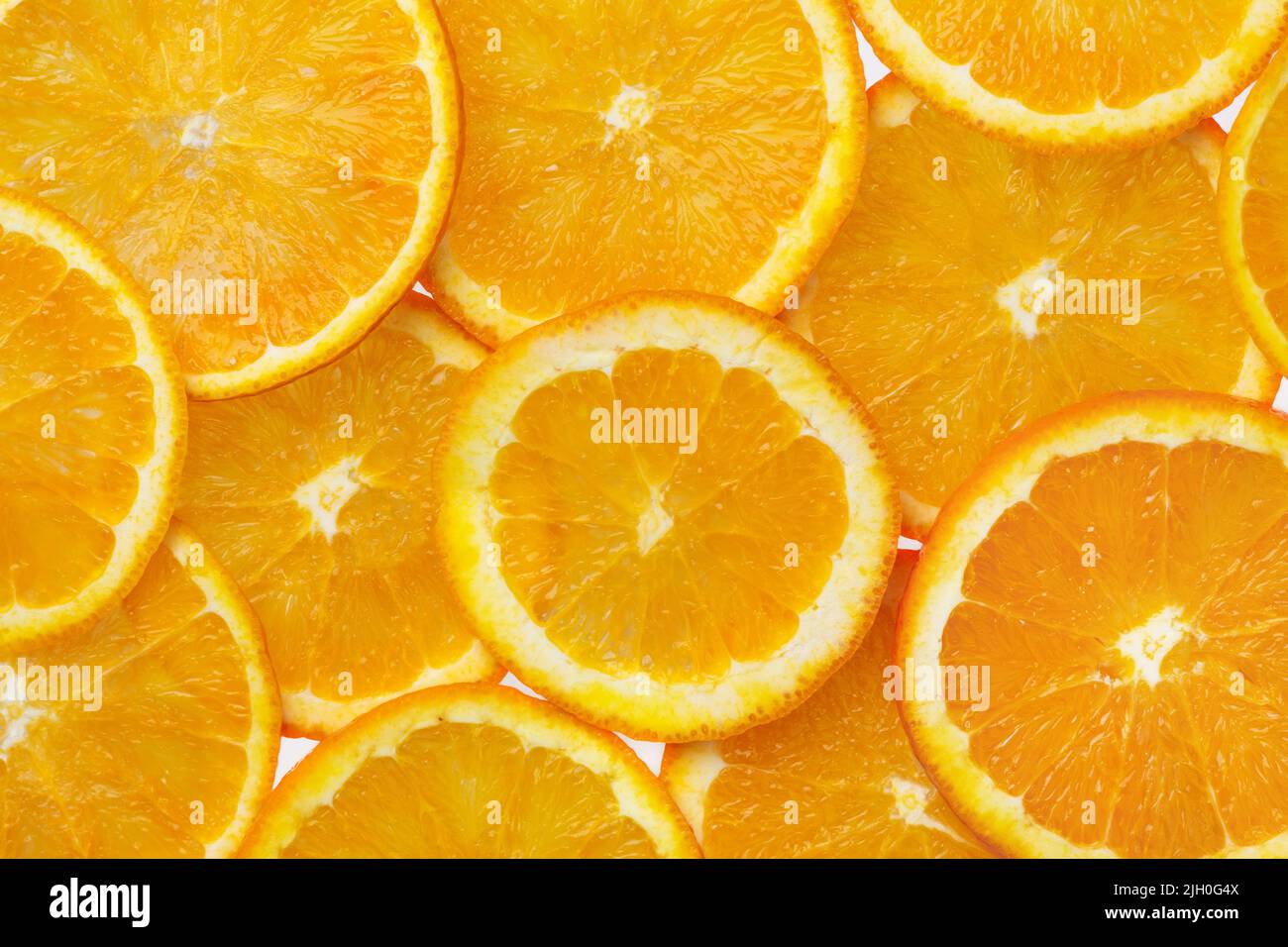 Many orange round slices top view. Orange citrus fruits background ...