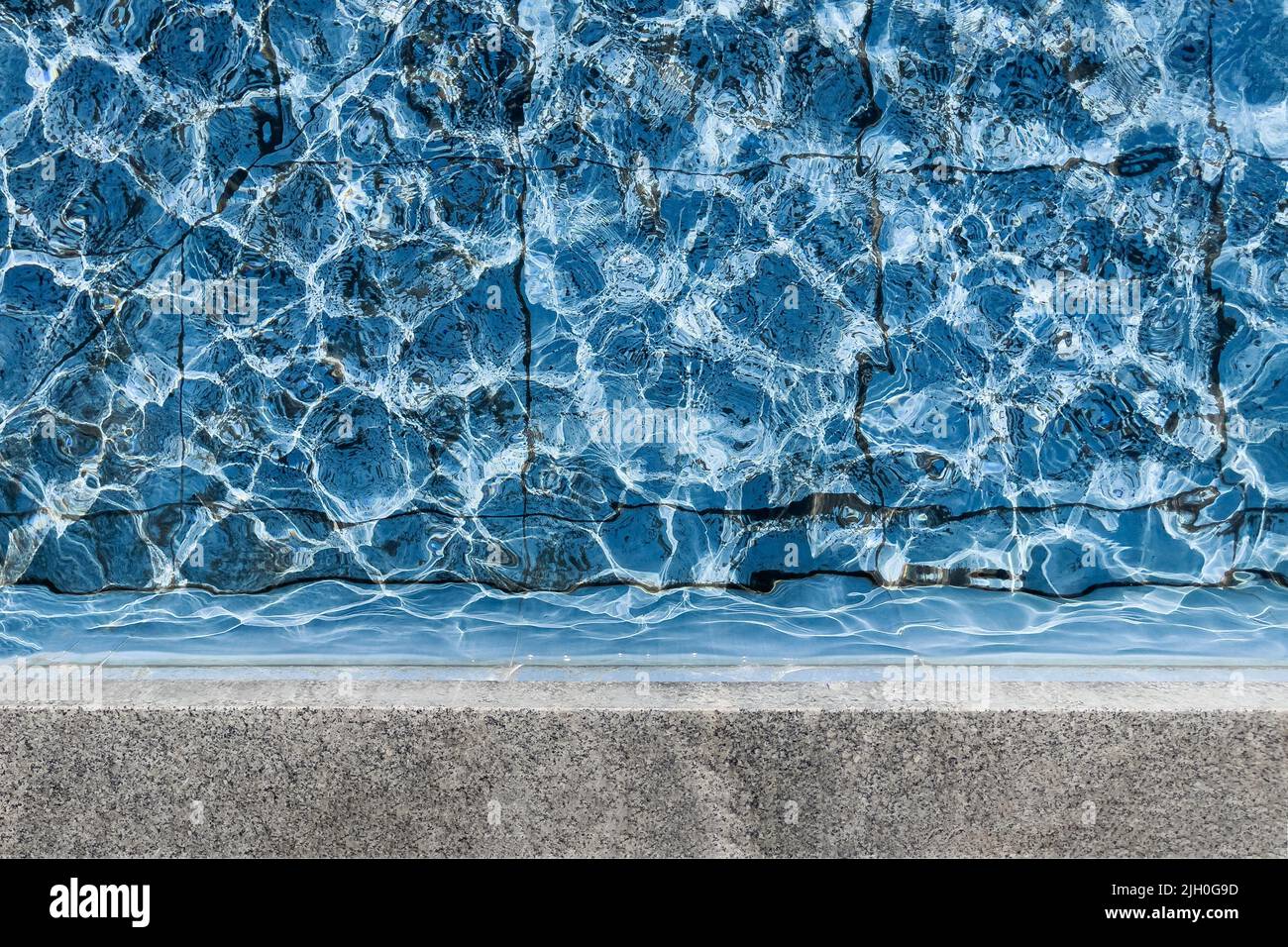 Blue water background of swimming pool. Ripple water in swimming pool ...