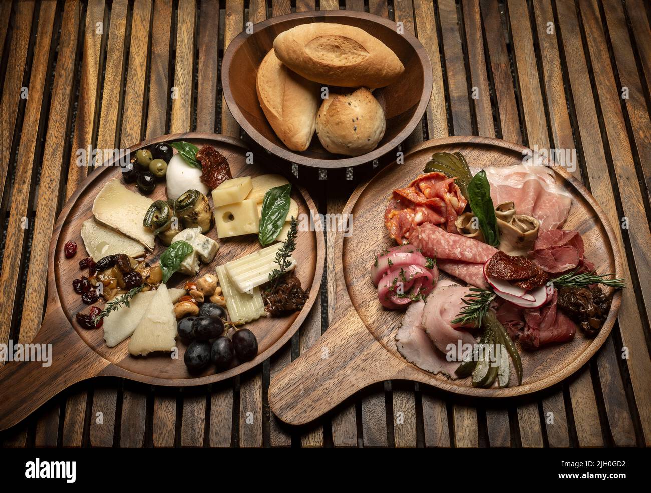 mixed european charcuterie and cheese cold cuts platter on wood table ...