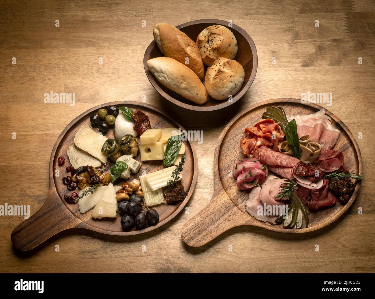 mixed european charcuterie and cheese cold cuts platter on wood table ...