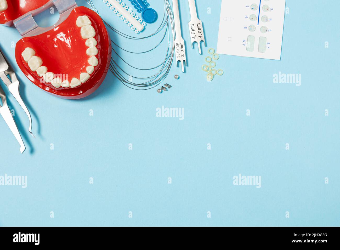 a set of special tools for an orthodontist to install braces for a ...