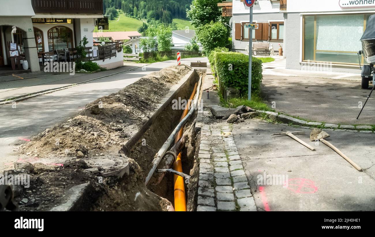 The view of a road digging for water pipes restoration Stock Photo - Alamy