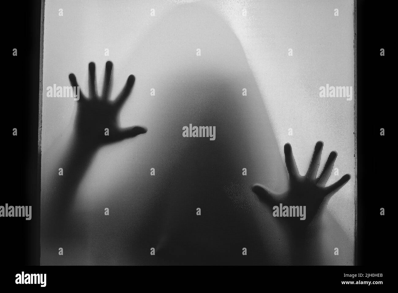 Horror ghost figure behind the matte glass. Halloween festival concept ...