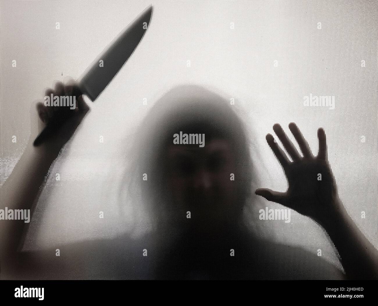 Horror, halloween background - Shadowy figure behind glass holding a ...