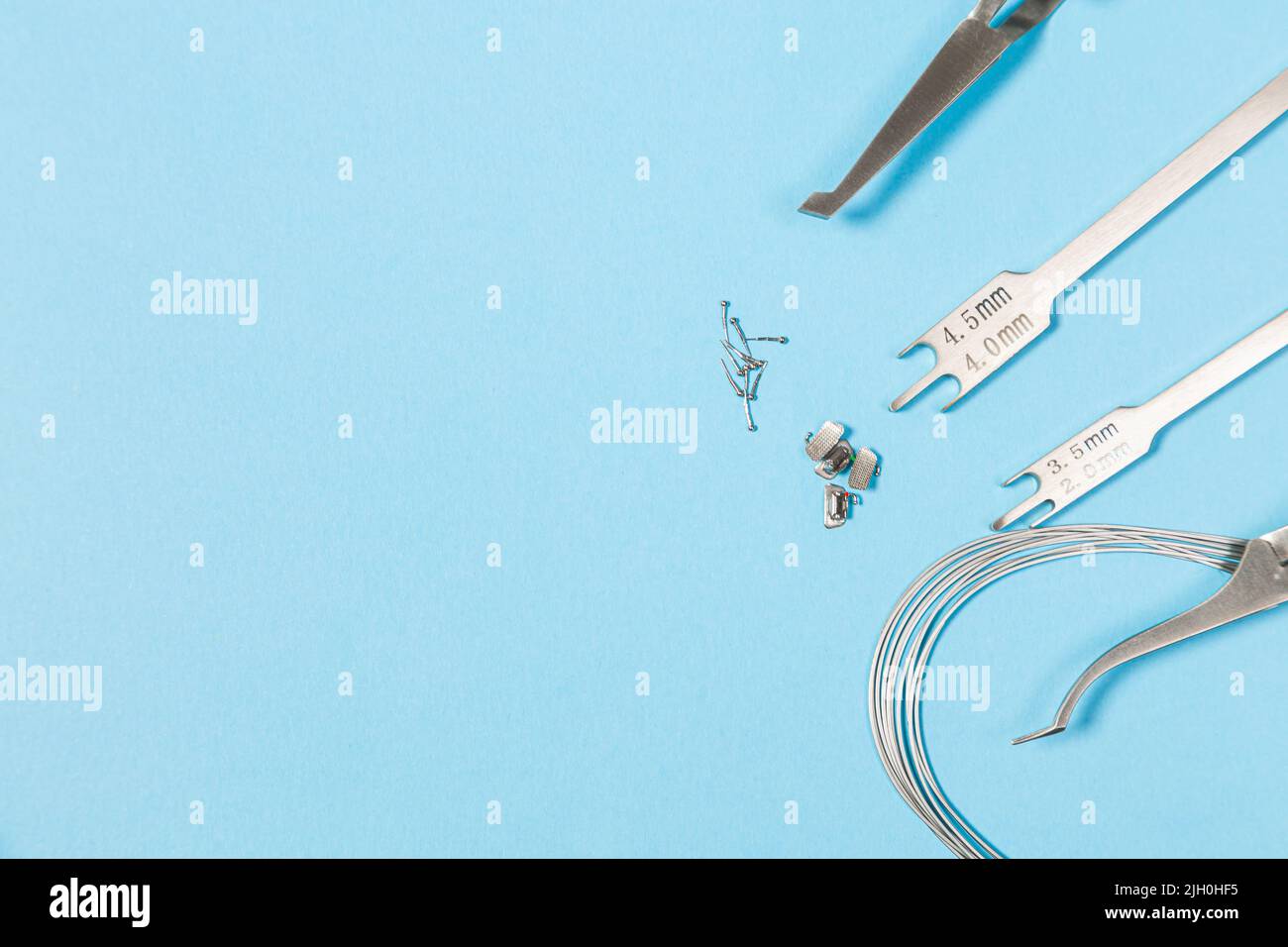 a set of special tools for an orthodontist to install braces for a ...