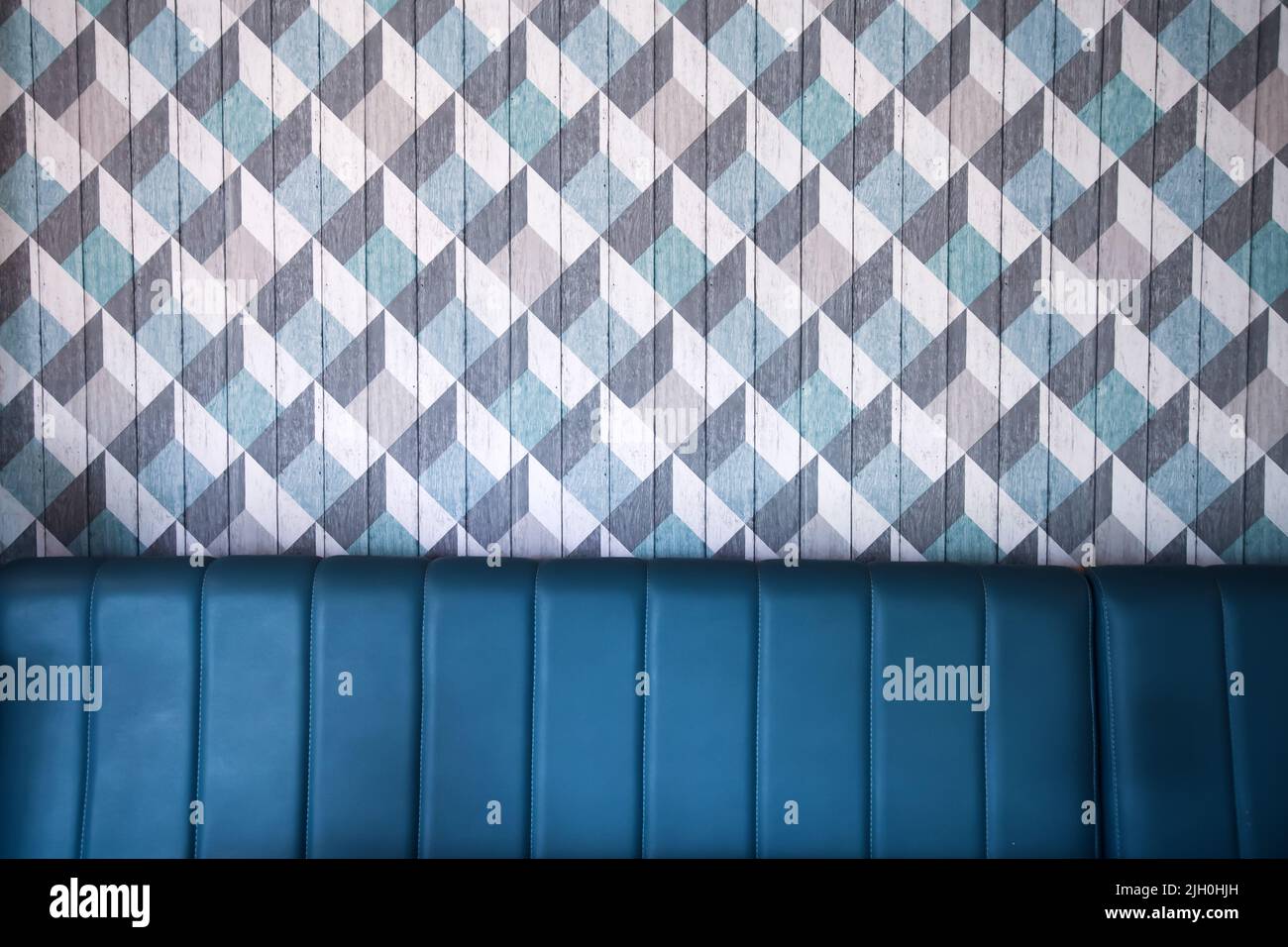 Close up on a modern restaurant interior with turquoise sofa and ...