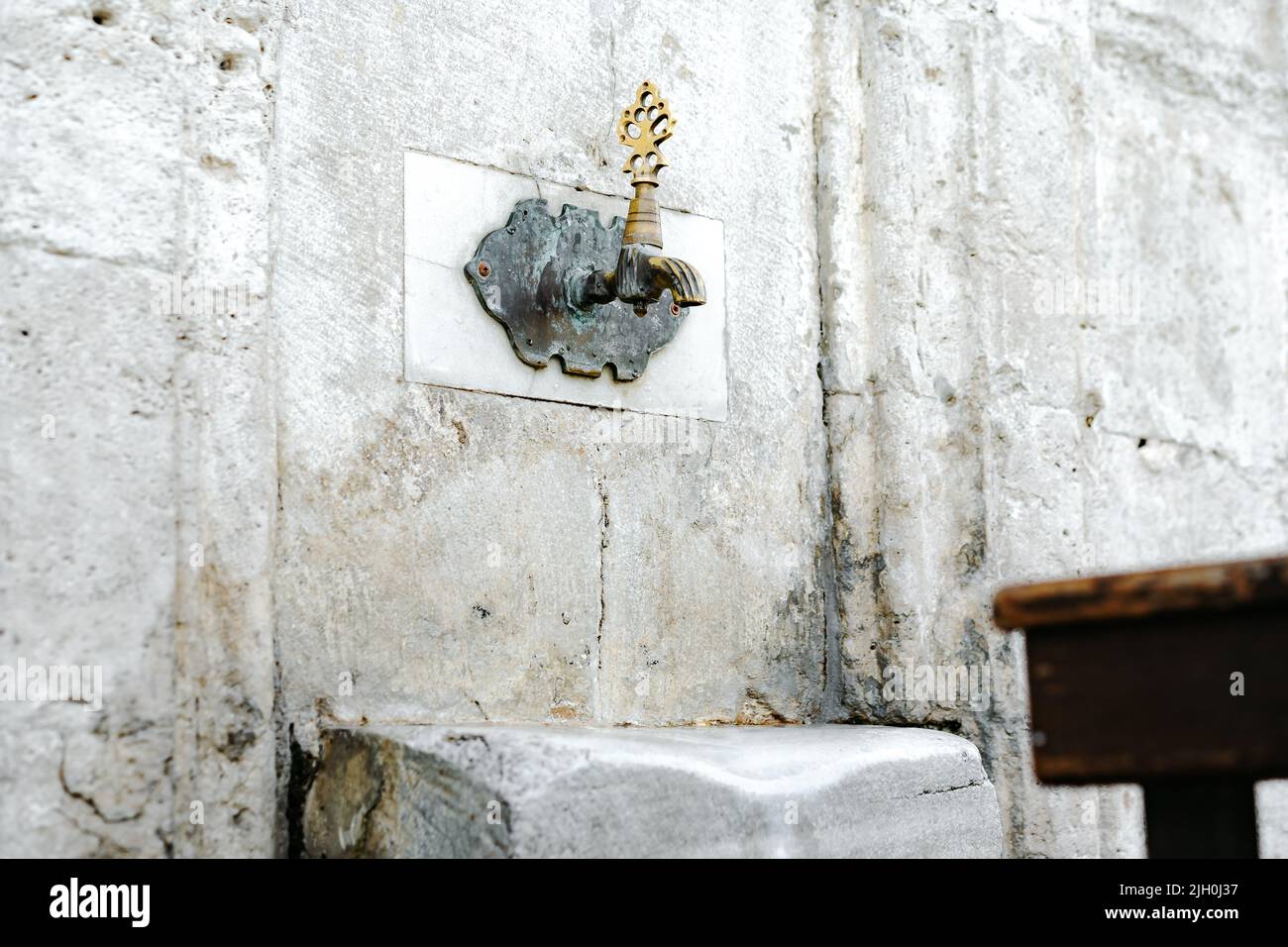 Water tap for washing hands and feet before the prayer in ablution ...
