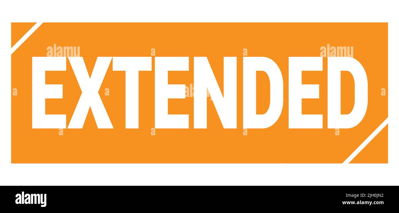 EXTENDED text written on orange grungy stamp sign Stock Photo - Alamy