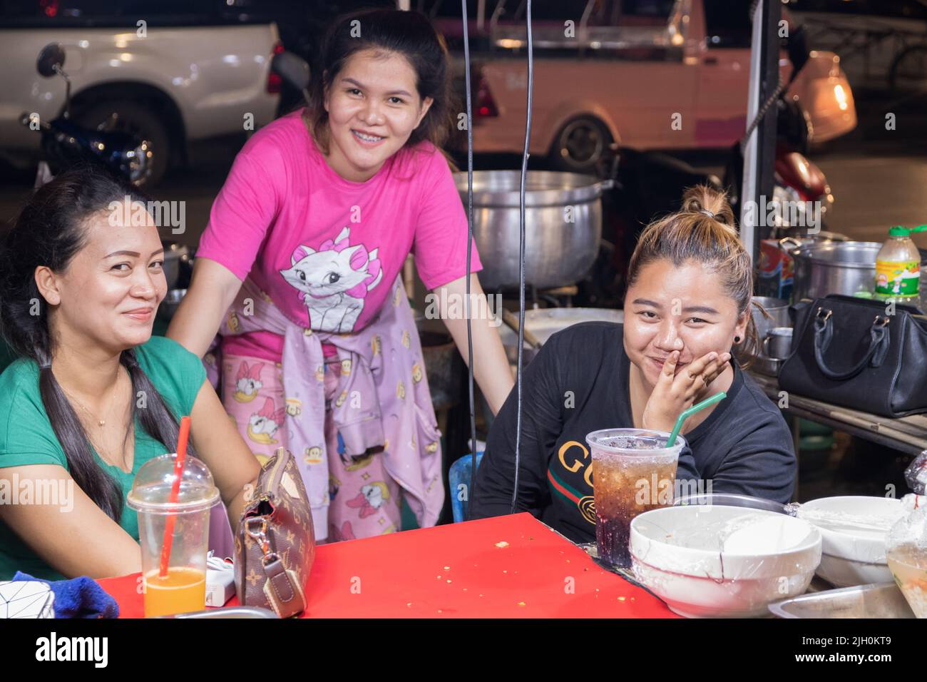 Thai people sell goods and street food at the Ayutthaya night market in ...