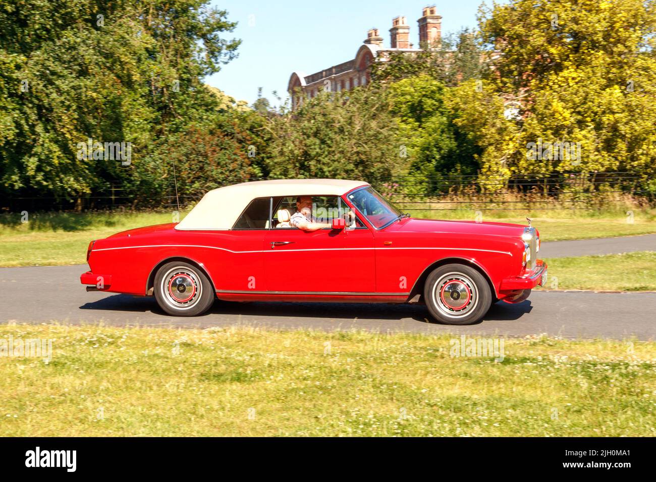 classic vintage 1980s red rolls Royce corniche convertible in front of ...