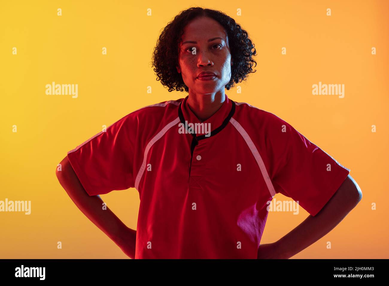 Portrait of african american female rugby player with arms crossed over ...