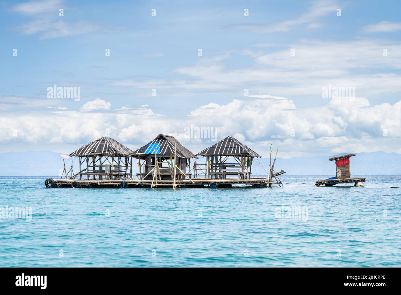 A manmade floating "island" is seen in the Tanon Strait, an area once ...