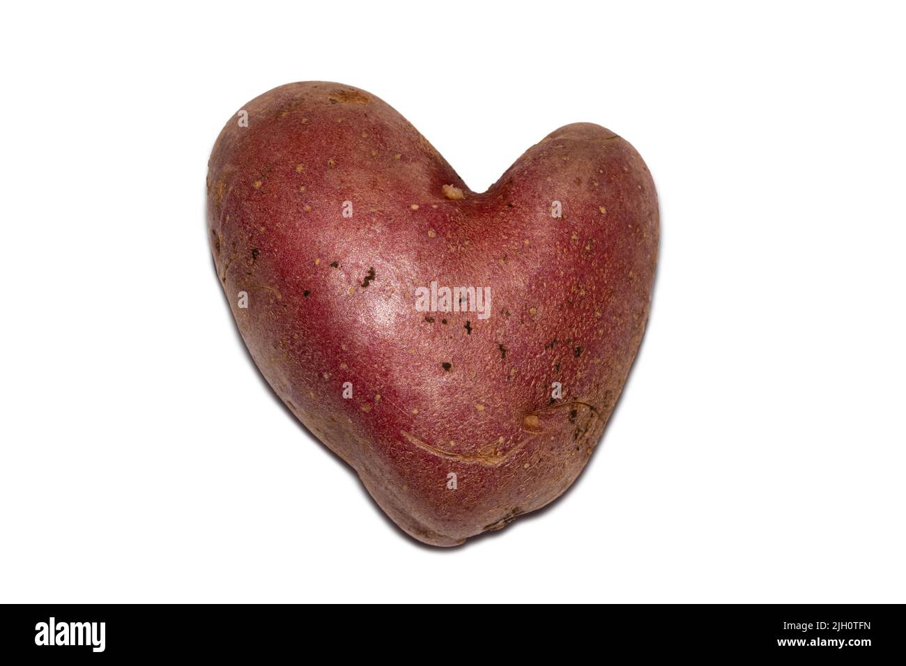 Potato in a heart shape on the white background Stock Photo - Alamy
