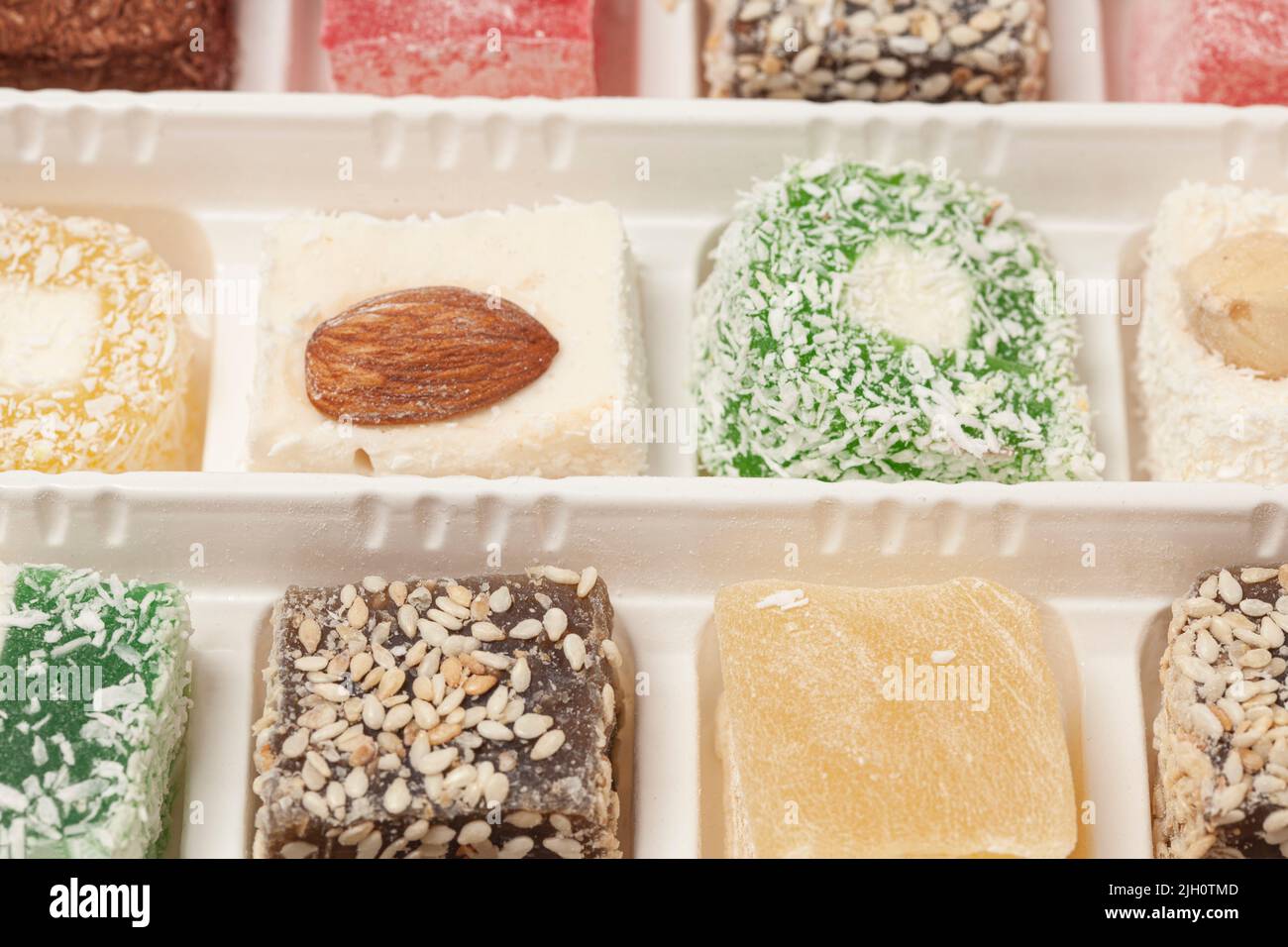 Cubes of traditional oriental sweets on a marble background, top view ...