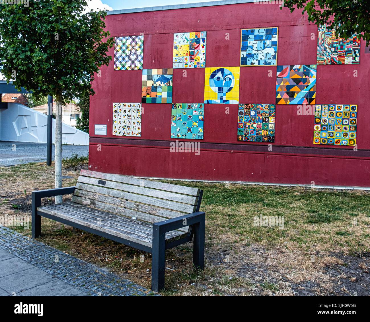 Urban Art, wall with colourful tiles near entrance of Zwickauer Damm U ...