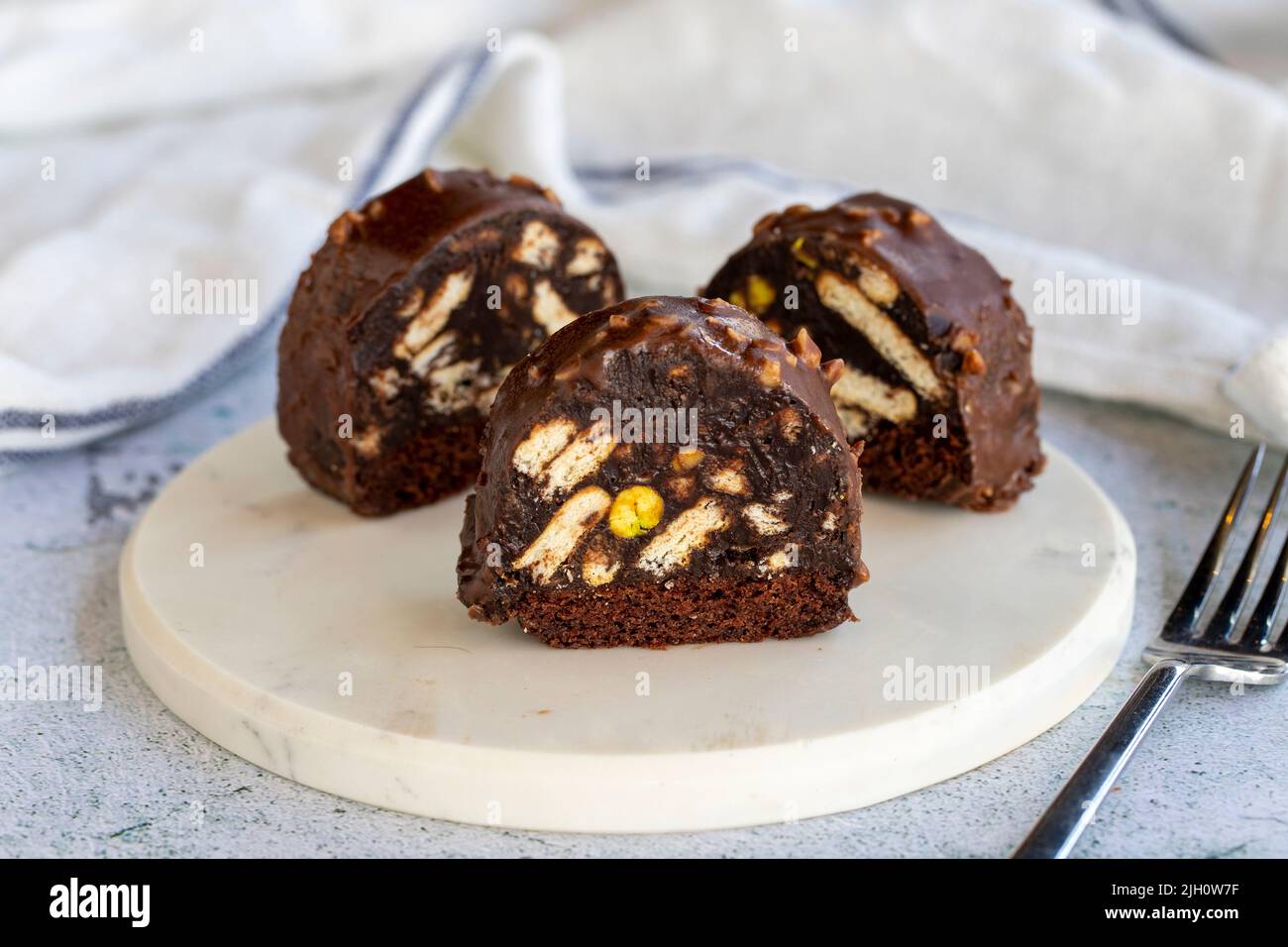 Mosaic cake. Mosaic cake with pistachio on a stone background ...