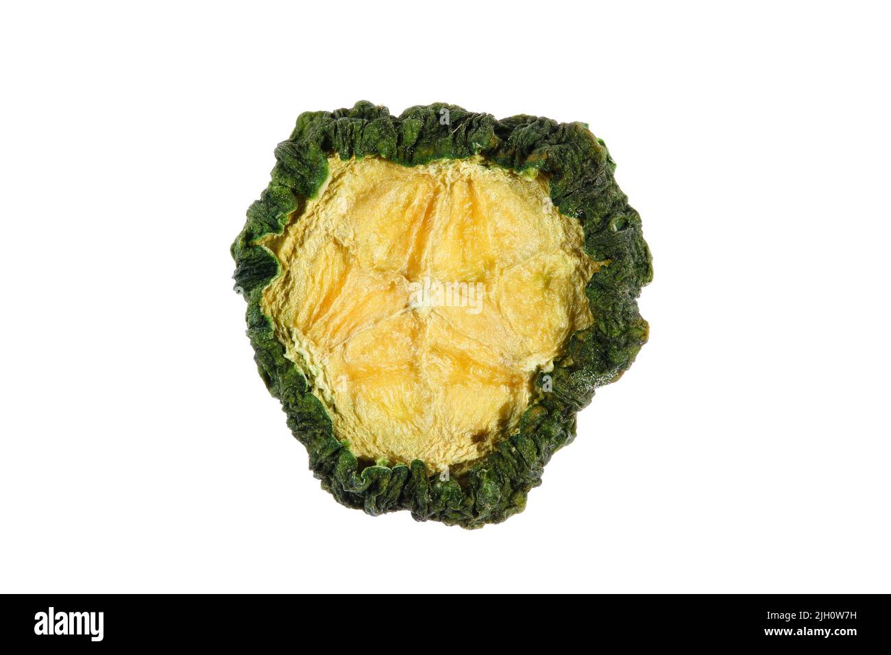 Extreme close up of a dehydrated slice of cucumber, isolated on white ...