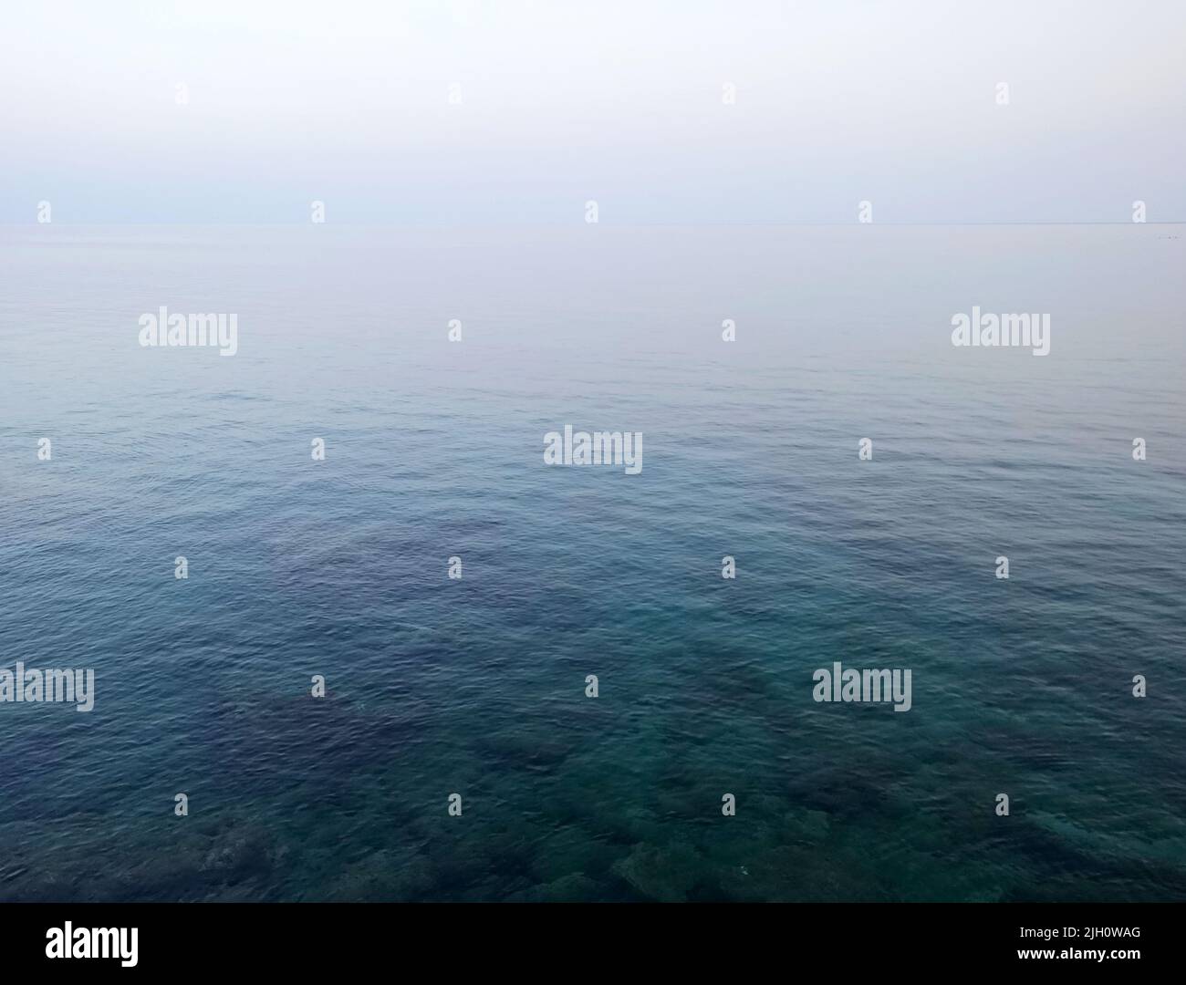Calm seascape with sky Stock Photo - Alamy