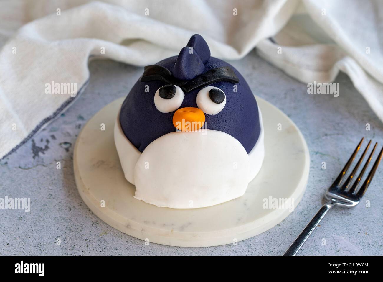 Design cake. Bird figured design cake on stone background. Design cake ...