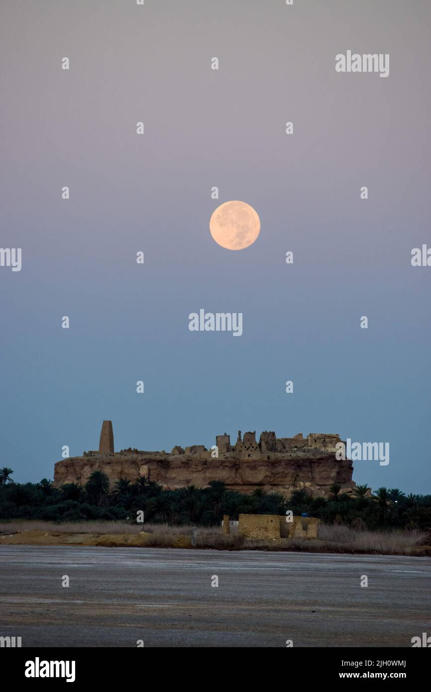 Siwa Oasis, Egypt, 14 July, 2022. The full moon of July setting over ...