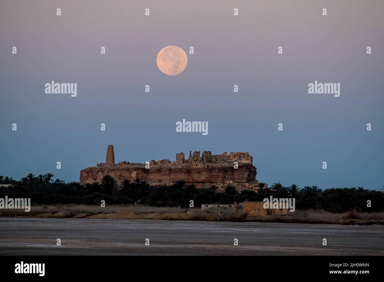 Siwa Oasis, Egypt, 14 July, 2022. The full moon of July setting over ...