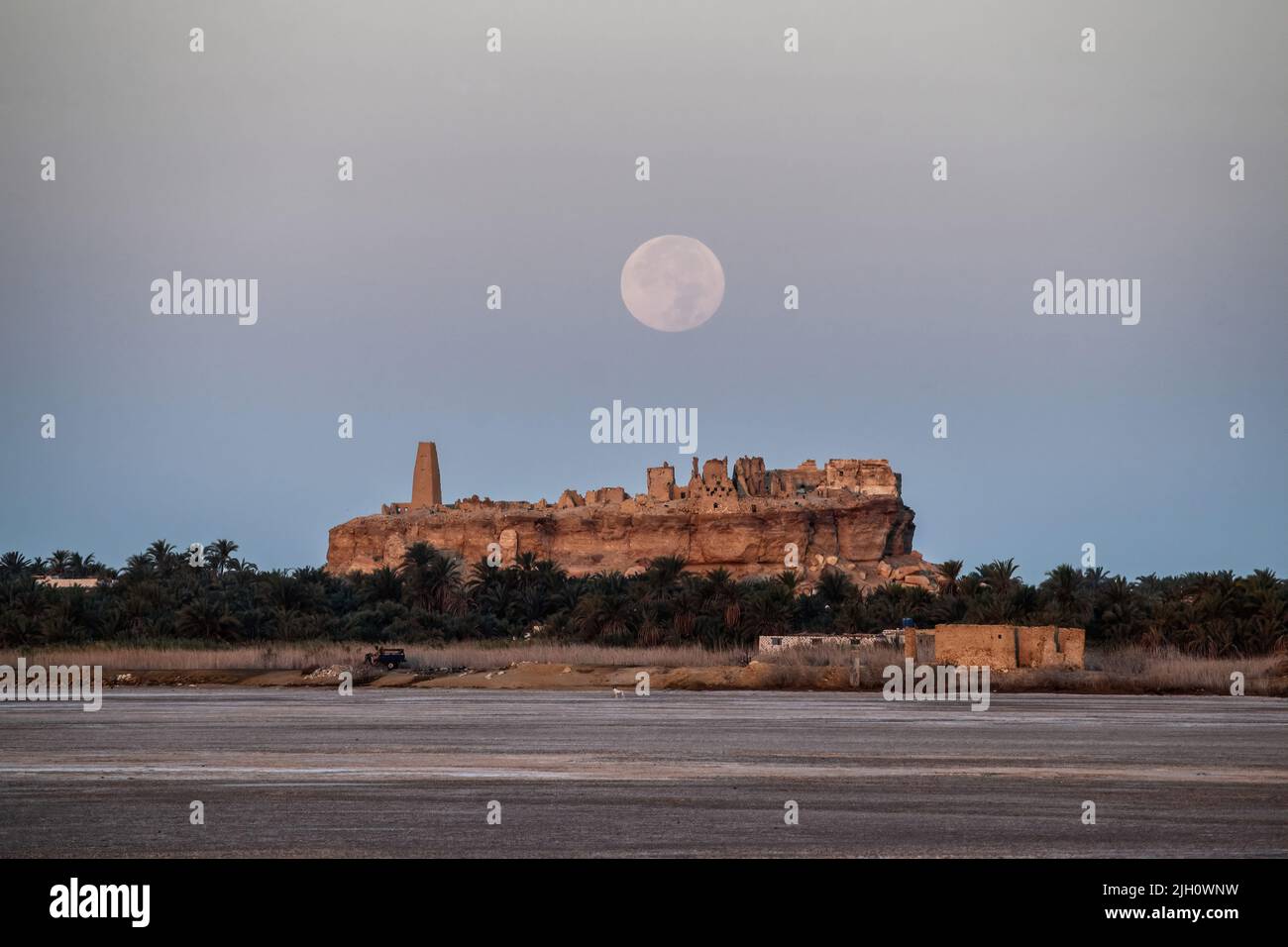 Siwa Oasis, Egypt, 14 July, 2022. The full moon of July setting over ...