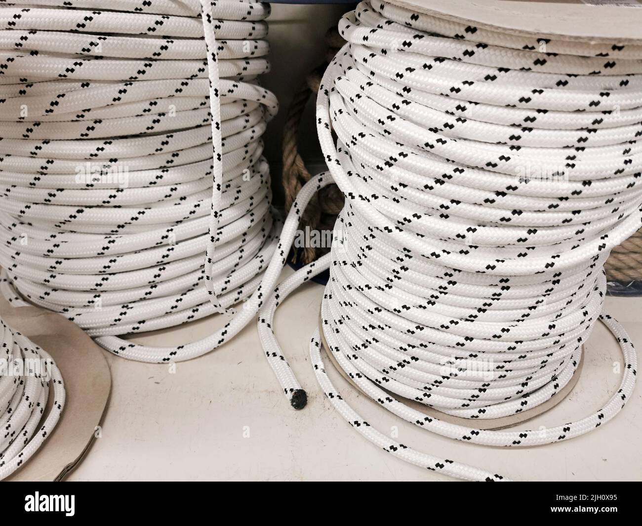 Rolls of white rope Stock Photo - Alamy