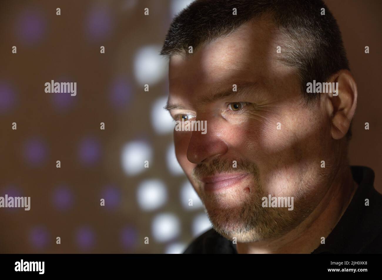 Portrait of a happy middle-aged man. A man with a peaceful smile on his ...