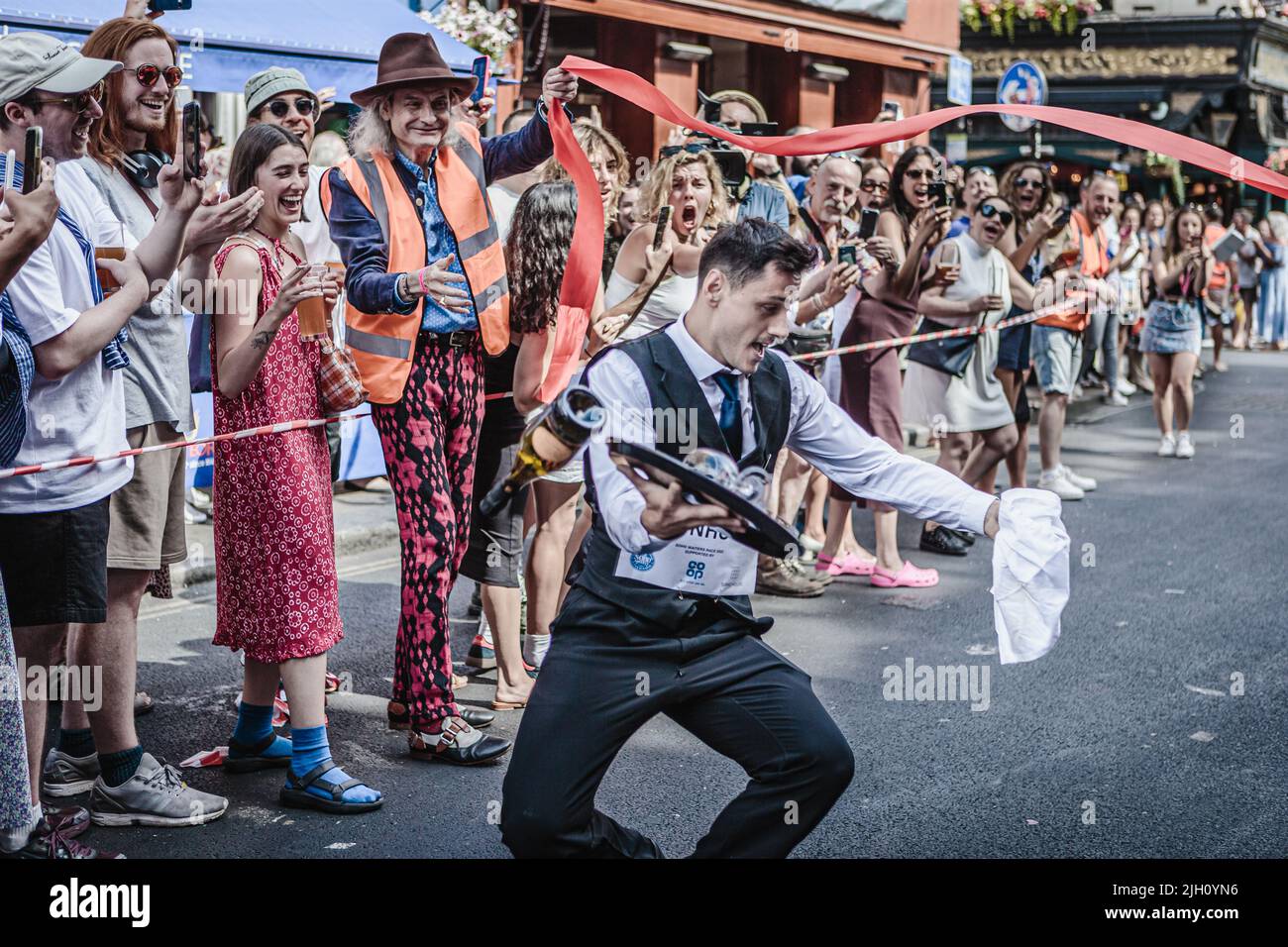 Winner of the Soho Waiters’ Race where restaurant staff sprint round ...