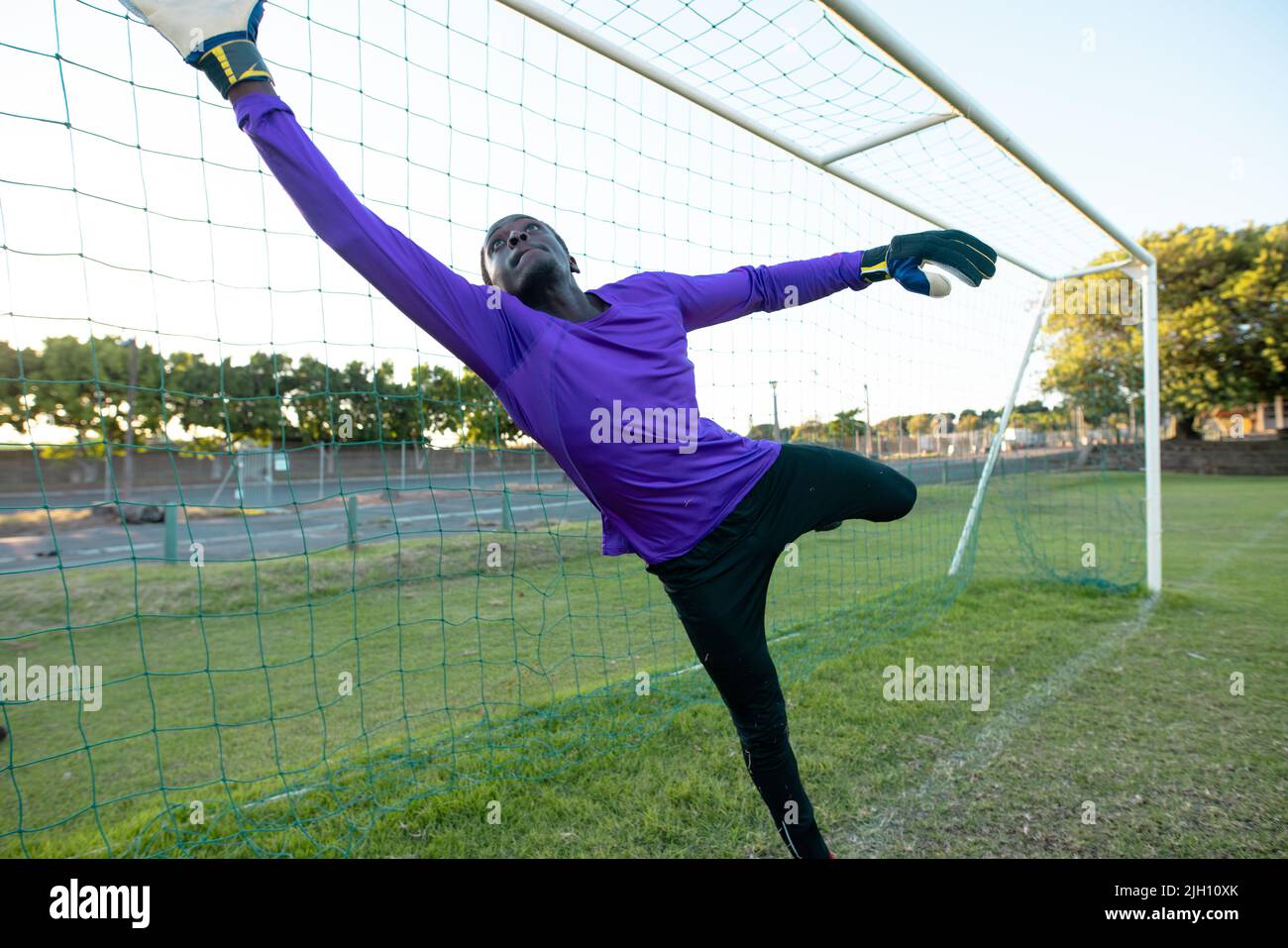 Male football player arms raised hi-res stock photography and images ...