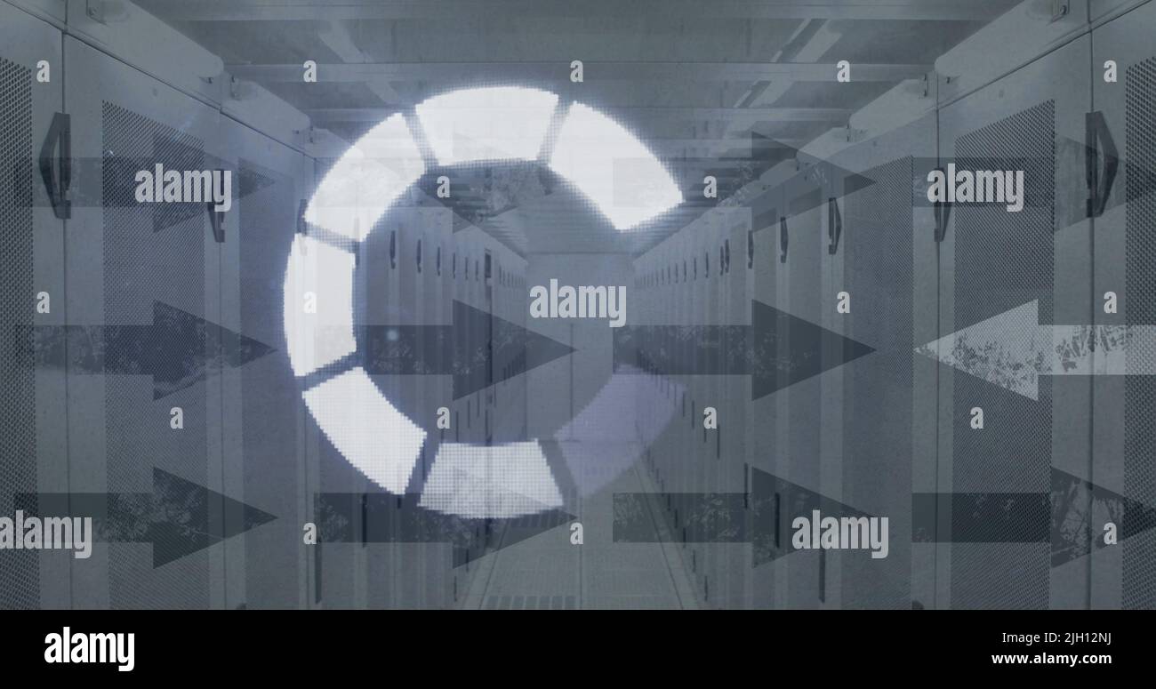 Image of loading ring over arrows and server room Stock Photo - Alamy