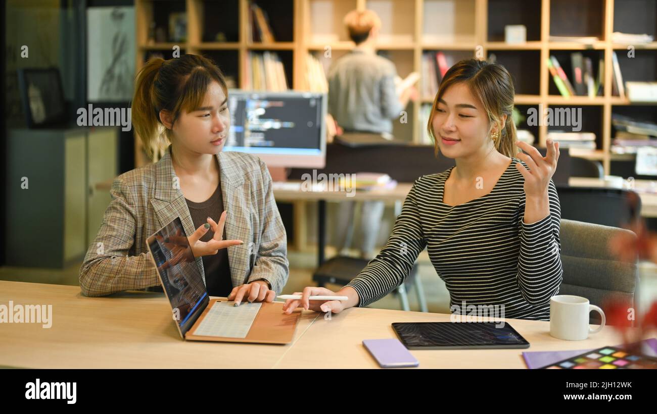 Two professional programmer cooperating and working together development website design and ...