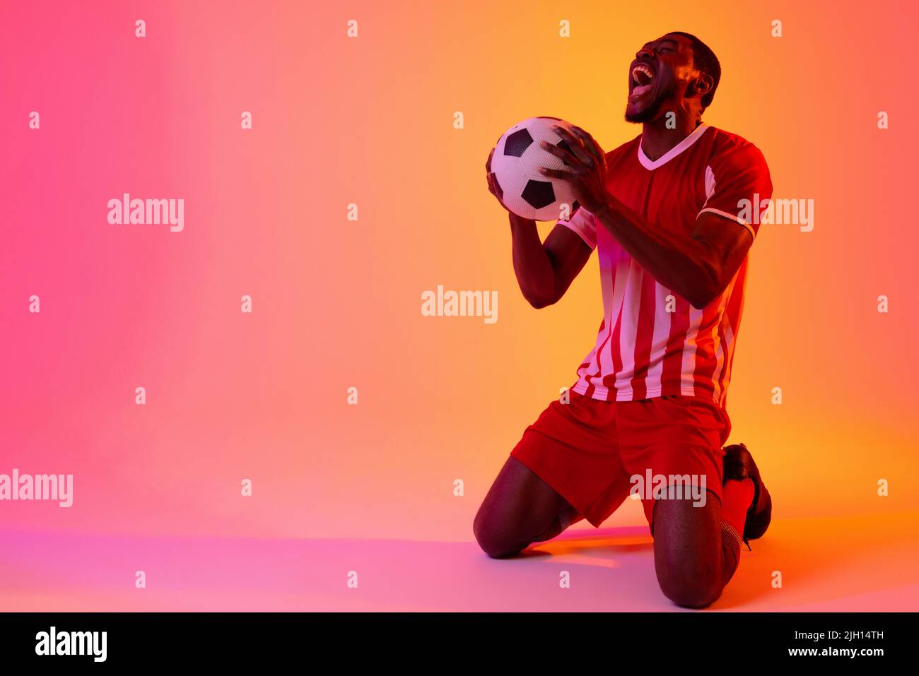 Happy soccer player hi-res stock photography and images - Alamy