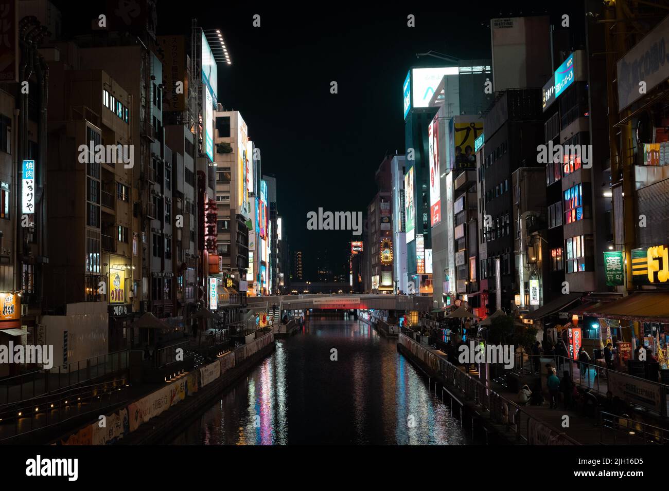 A night city view with Dotonbori River between buildings in Osaka ...