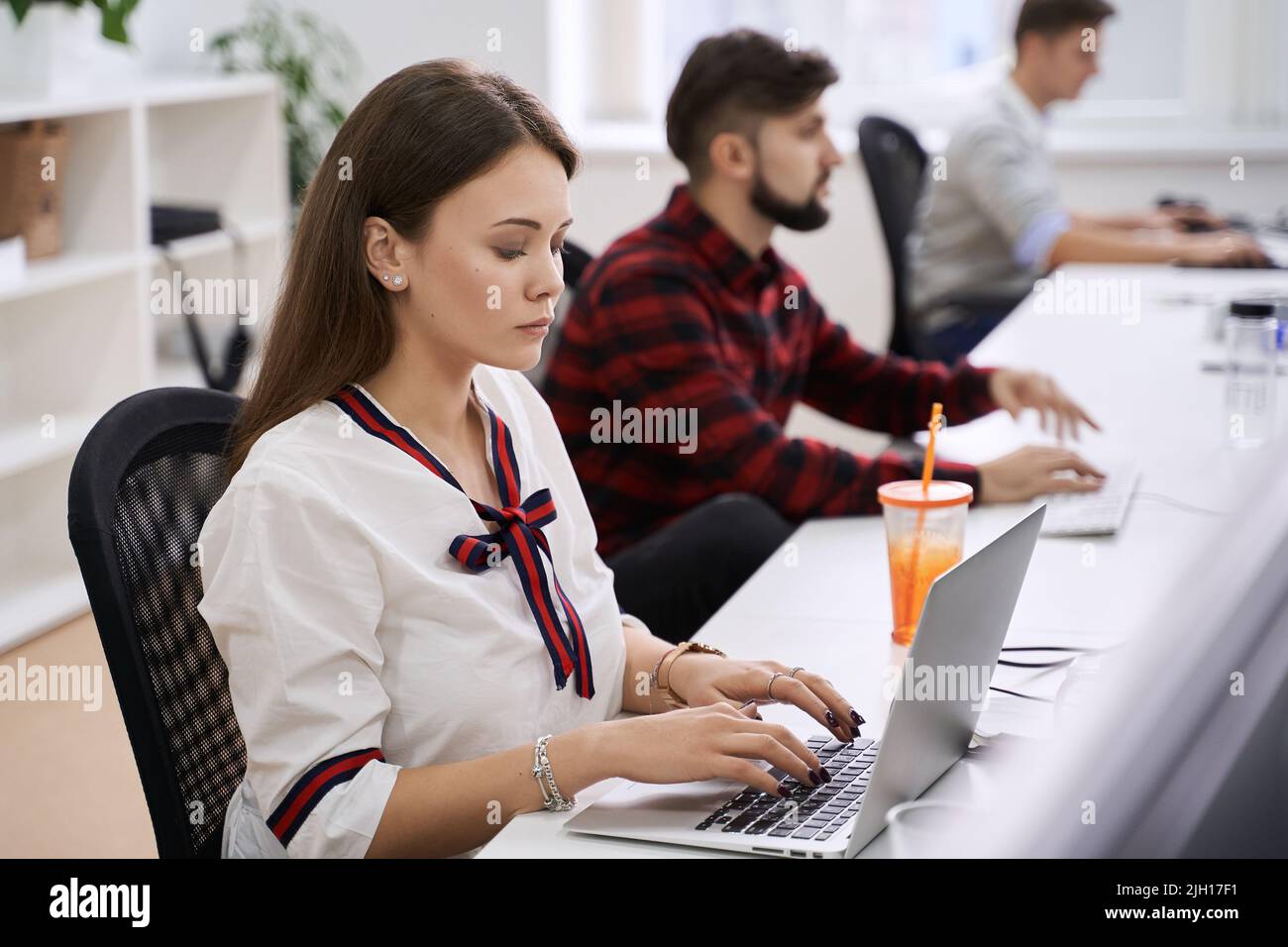 People working in modern IT office. Group of young and experienced ...