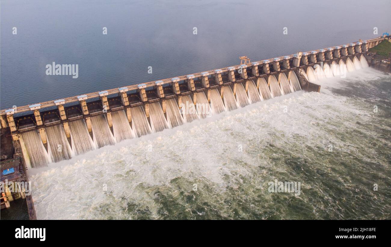 An aerial shot of large dam with foam water Stock Photo - Alamy