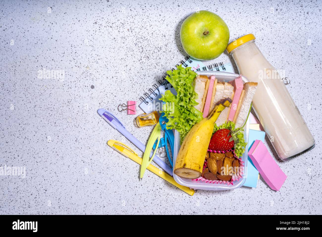 Healthy school lunch box: sandwich, vegetables, fruit, nuts and yogurt ...