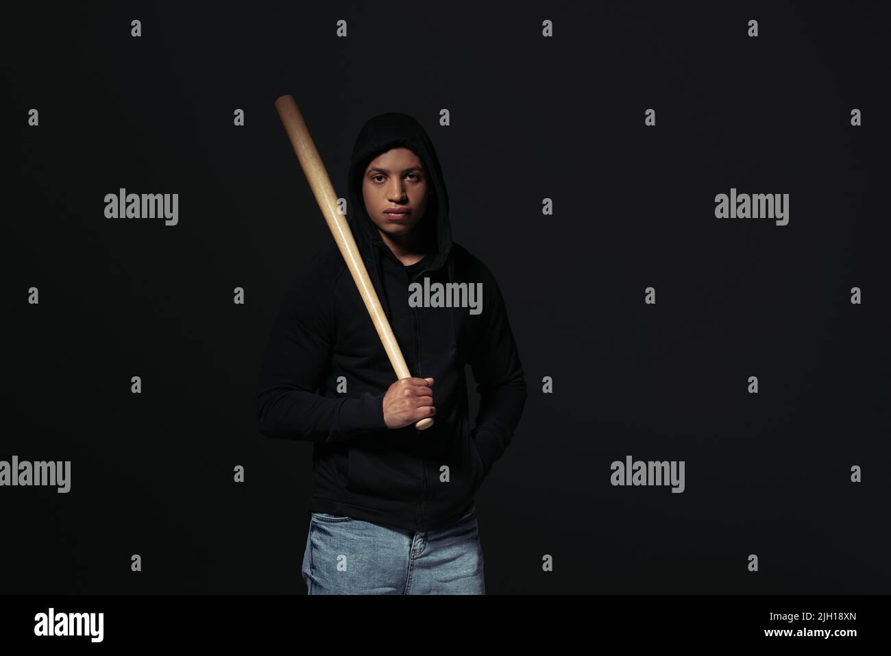 African american hooligan holding baseball bat isolated on black Stock ...