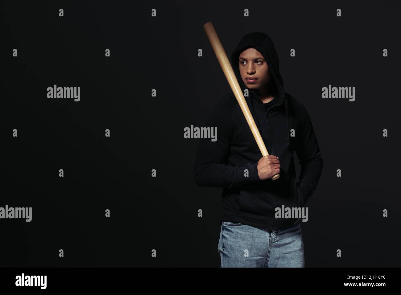 African american hooligan with baseball bat looking away isolated on ...
