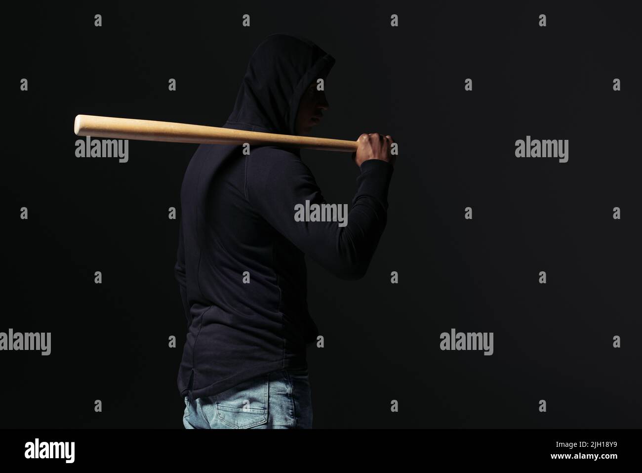 Side view of african american hooligan holding baseball bat isolated on ...