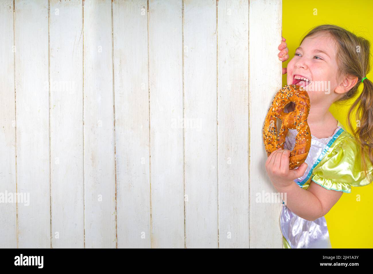 German Bavarian Oktoberfest holiday concept. Funny smile cute little ...