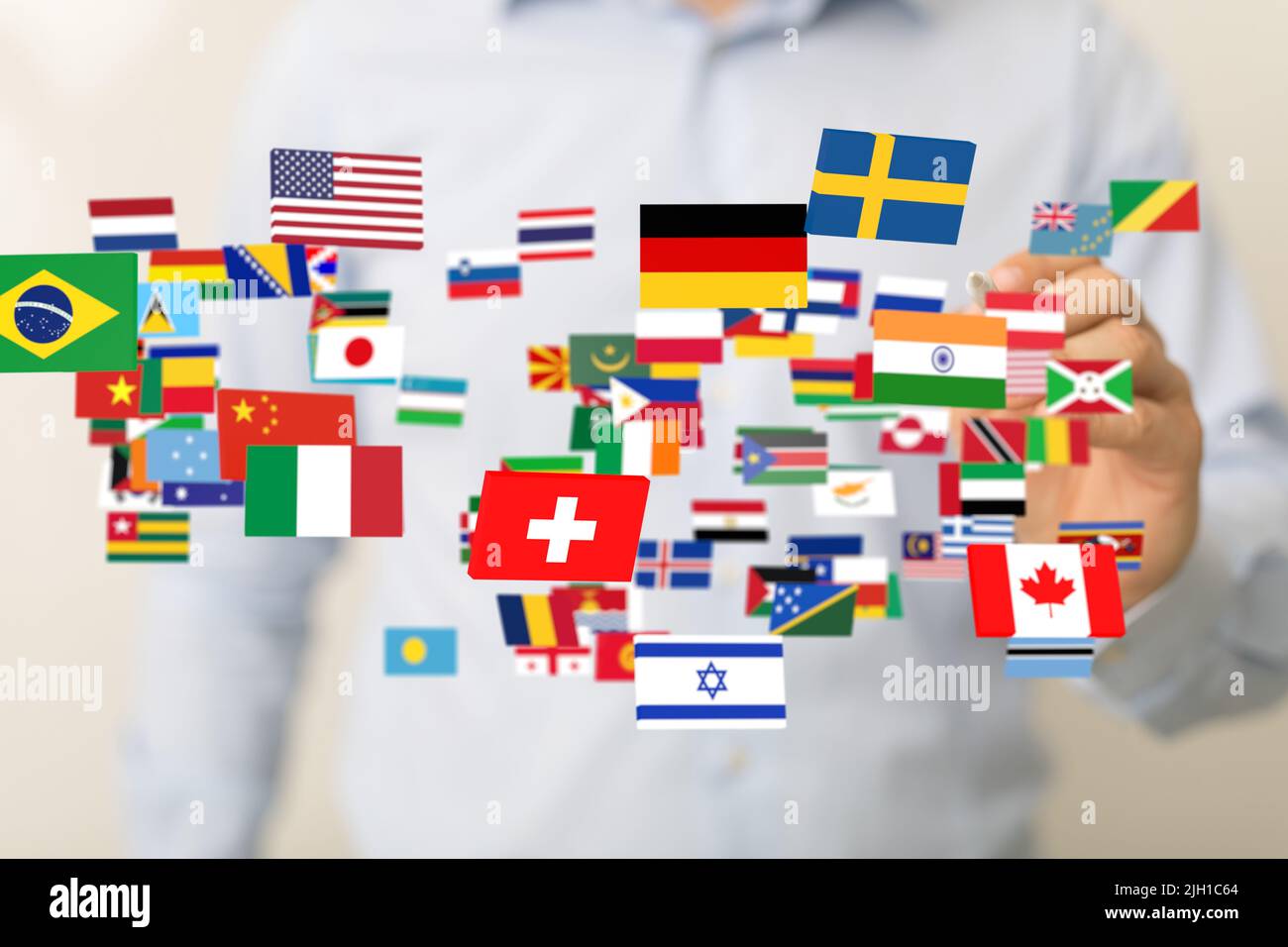 A person presenting a virtual projection of country flags Stock Photo ...