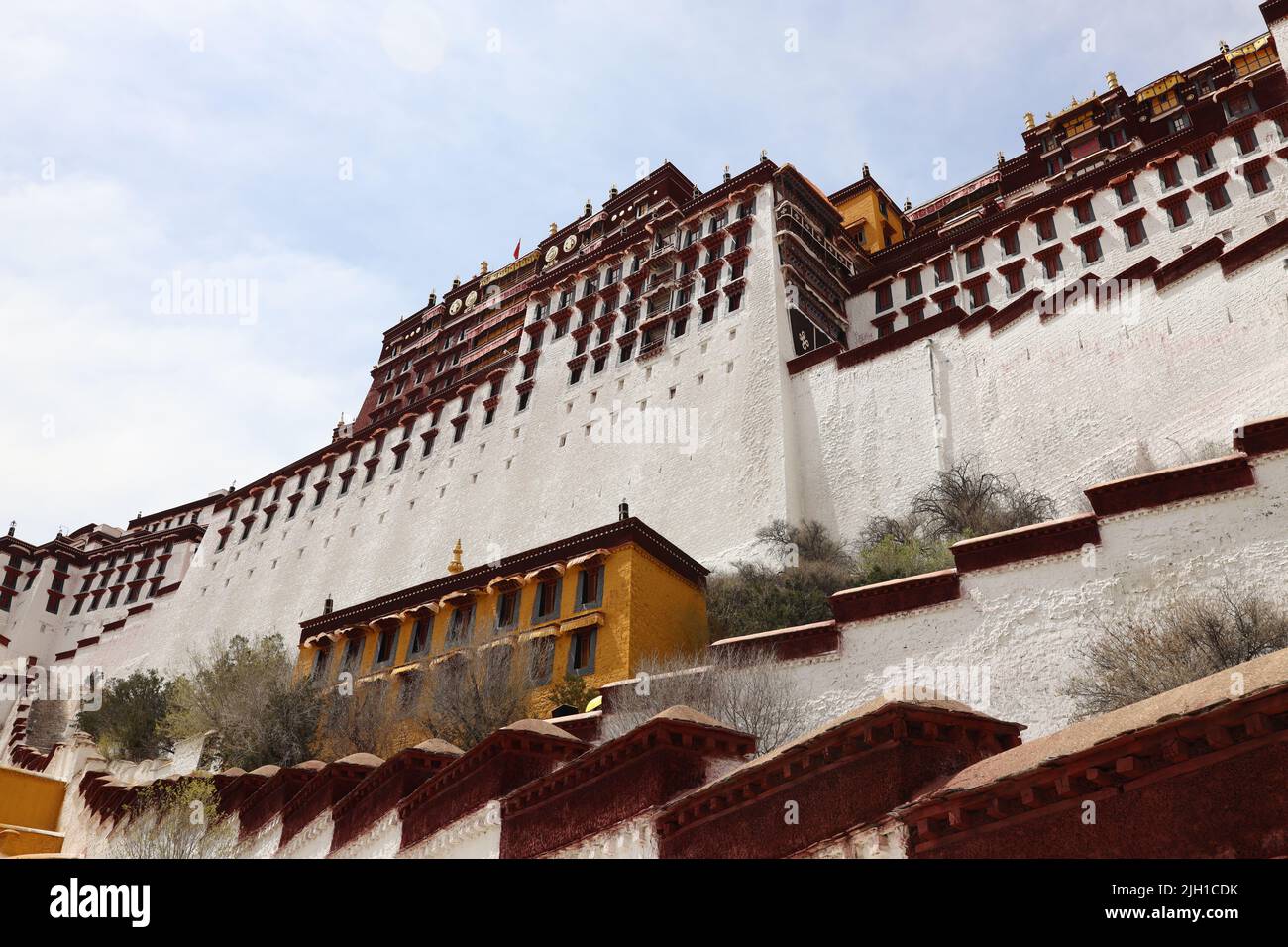 An exterior view of the Potala Palace in Lhasa, China in cloudy sky ...