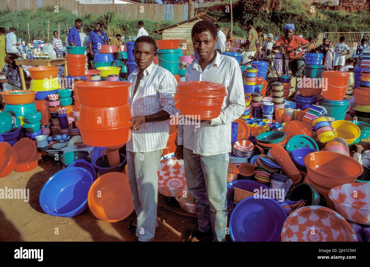 Uganda; Men selling plastic buckets at a market Stock Photo - Alamy