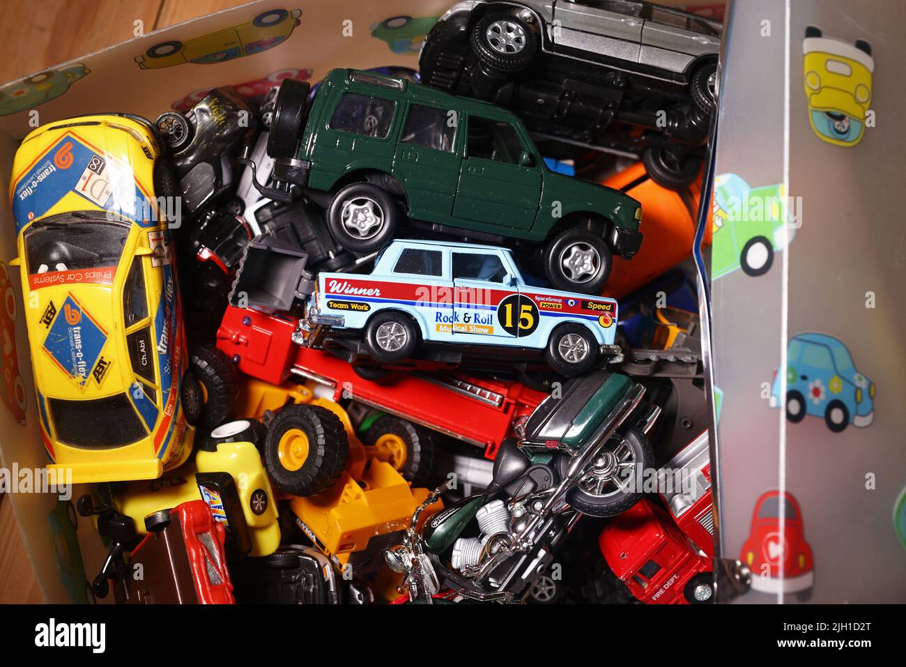 Toys in a box in an attic of a house. Here are small toy cars Stock ...